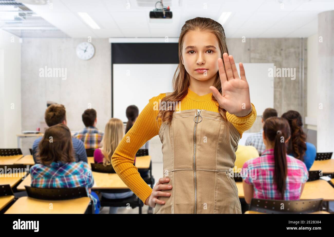 student girl making stopping gesture at school Stock Photo - Alamy