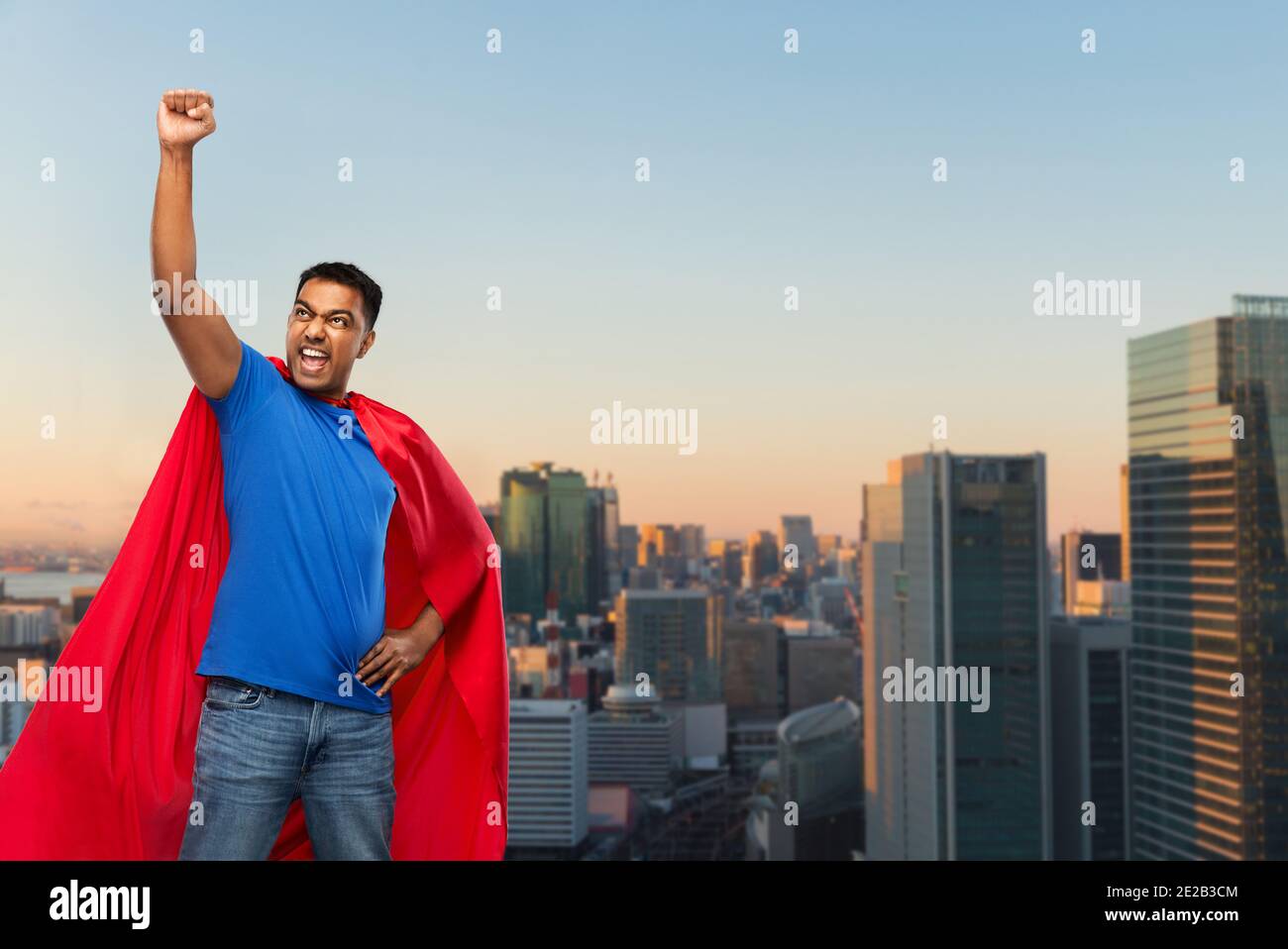indian superhero makes winning gesture in city Stock Photo - Alamy