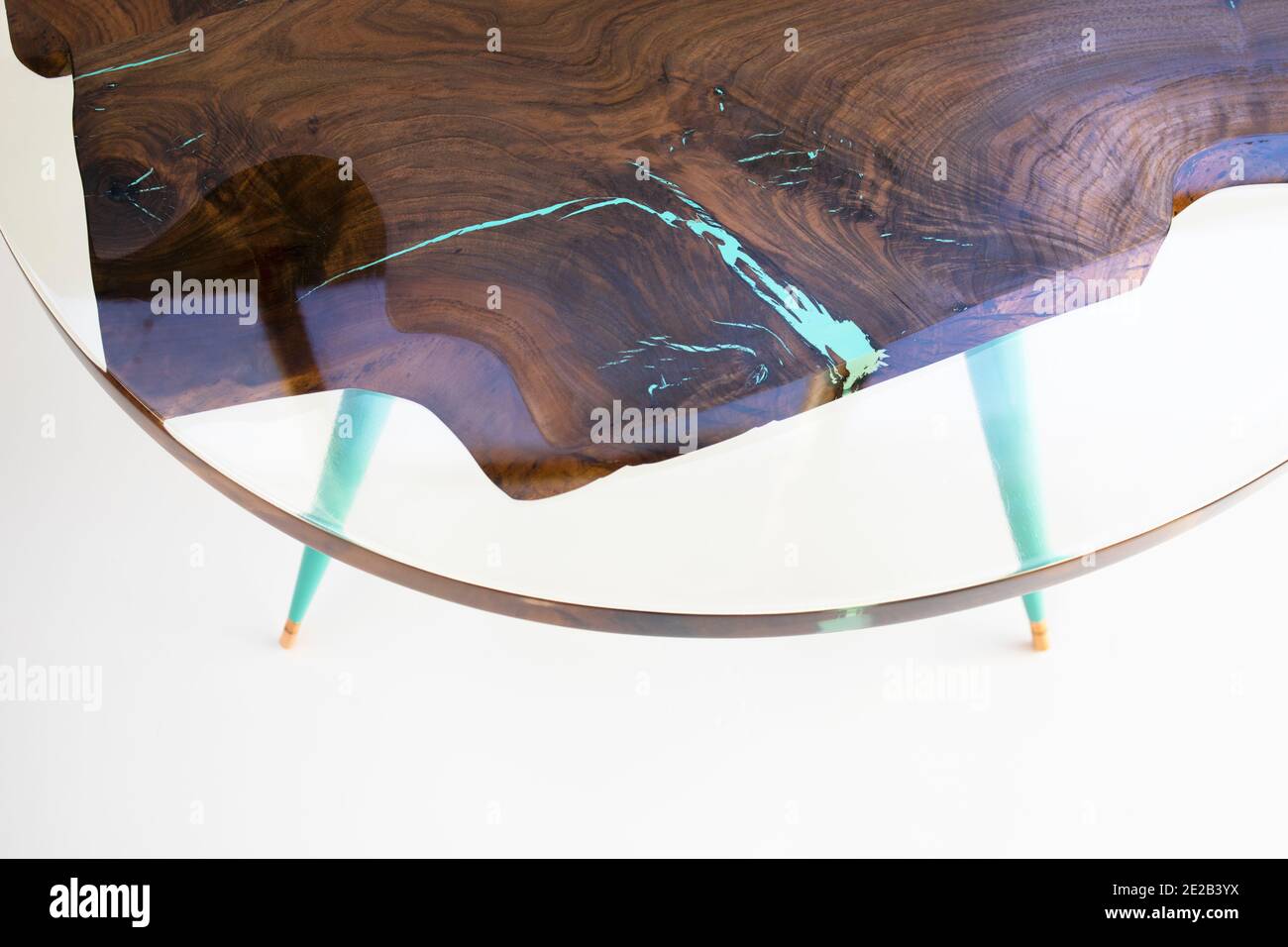 Modern handmade table made from walnut tree on a white background Stock ...