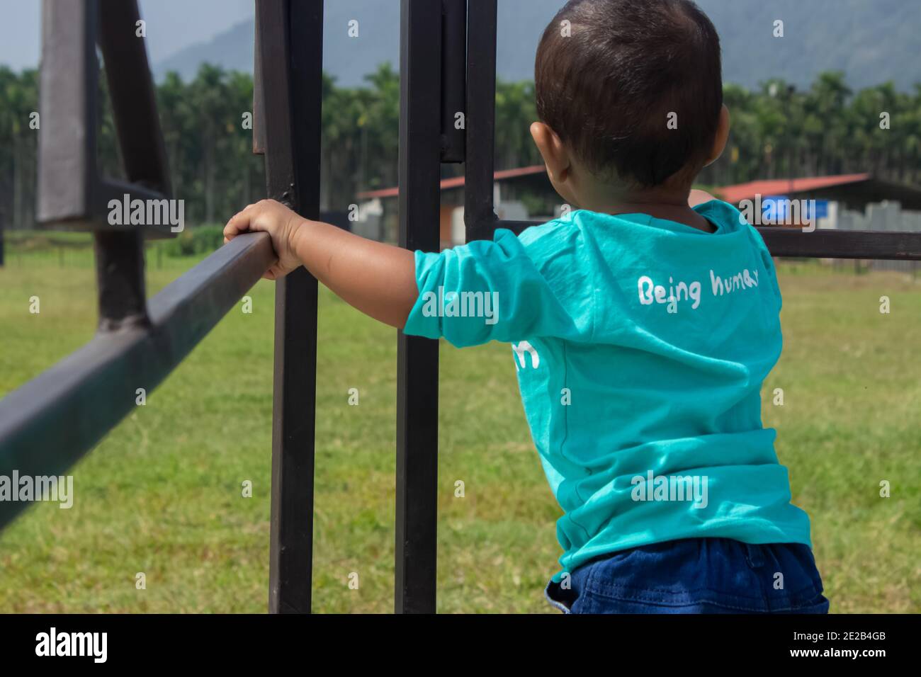 Cute Baby Boy Standing and Playing On Children Park. Close up portrait ...