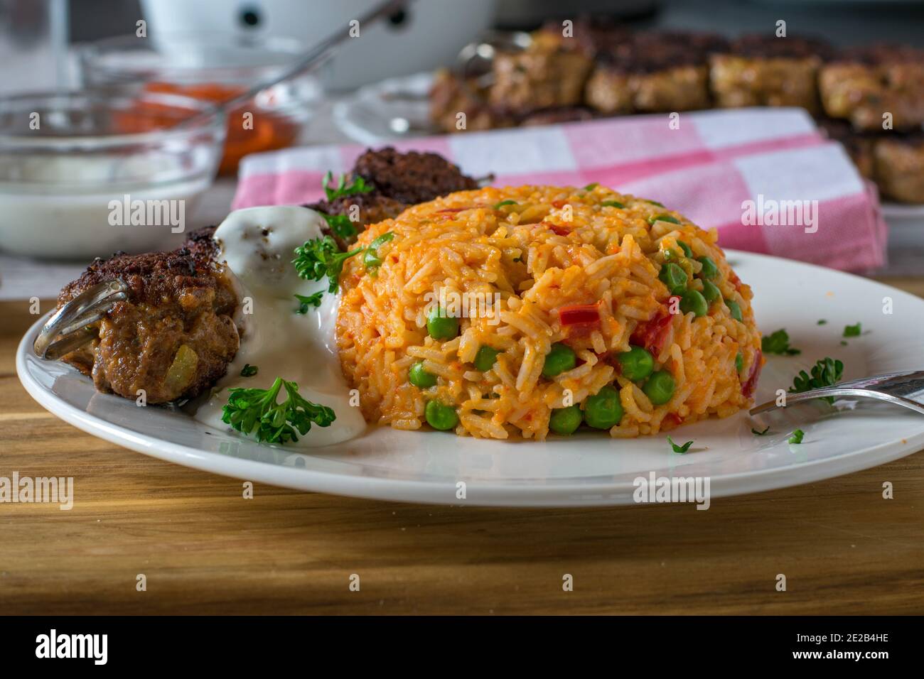 mediterranean djuvec rice with meat skewers and dip Stock Photo - Alamy