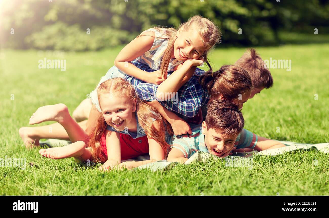happy kids playing and having fun in summer park Stock Photo - Alamy