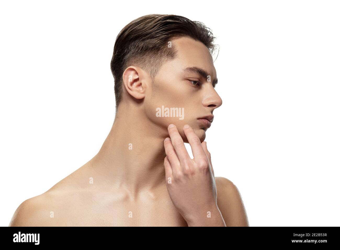Thoughtful. Portrait of young man isolated on white studio background ...