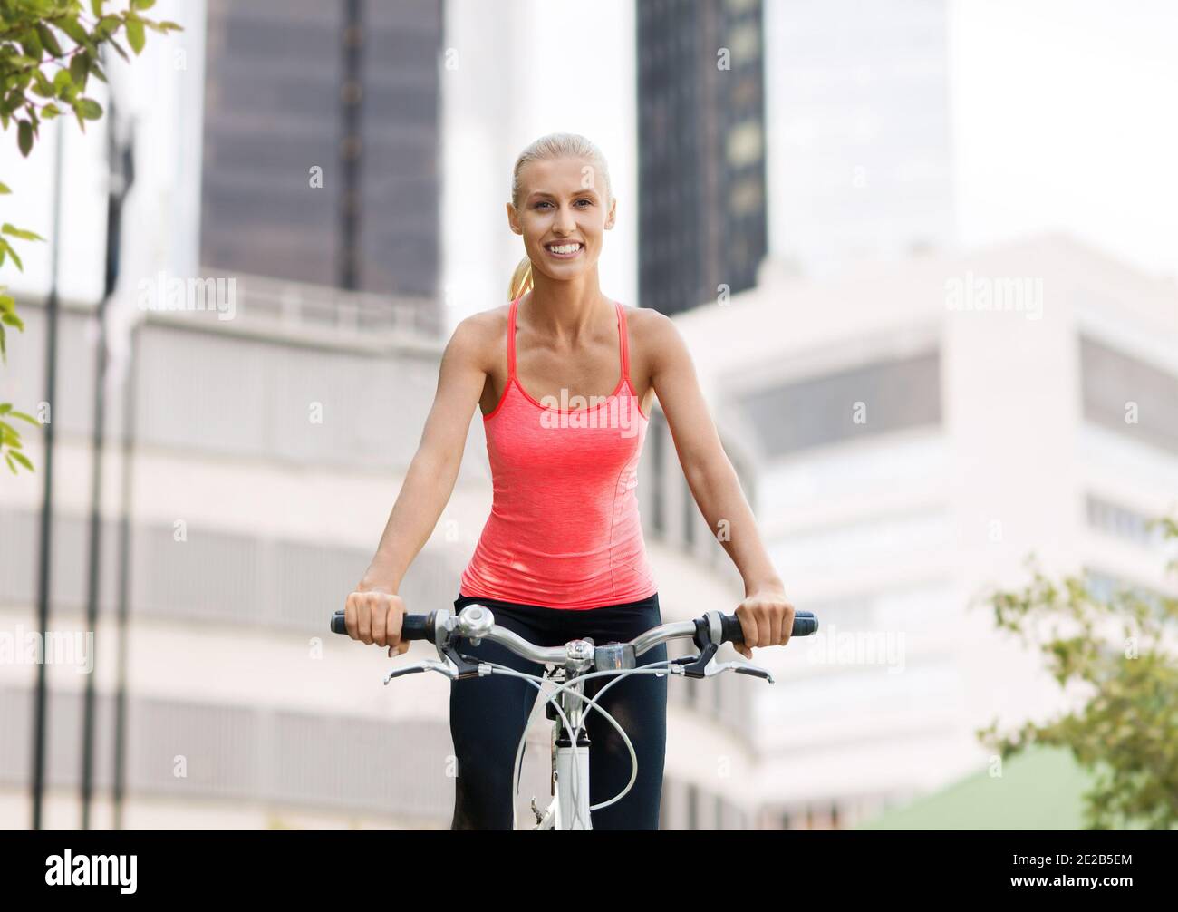 Beautiful young woman riding bicycle hi-res stock photography and ...
