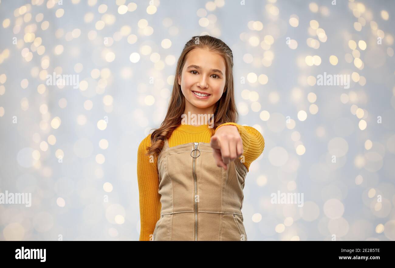 smiling young teenage girl pointing to camera Stock Photo - Alamy