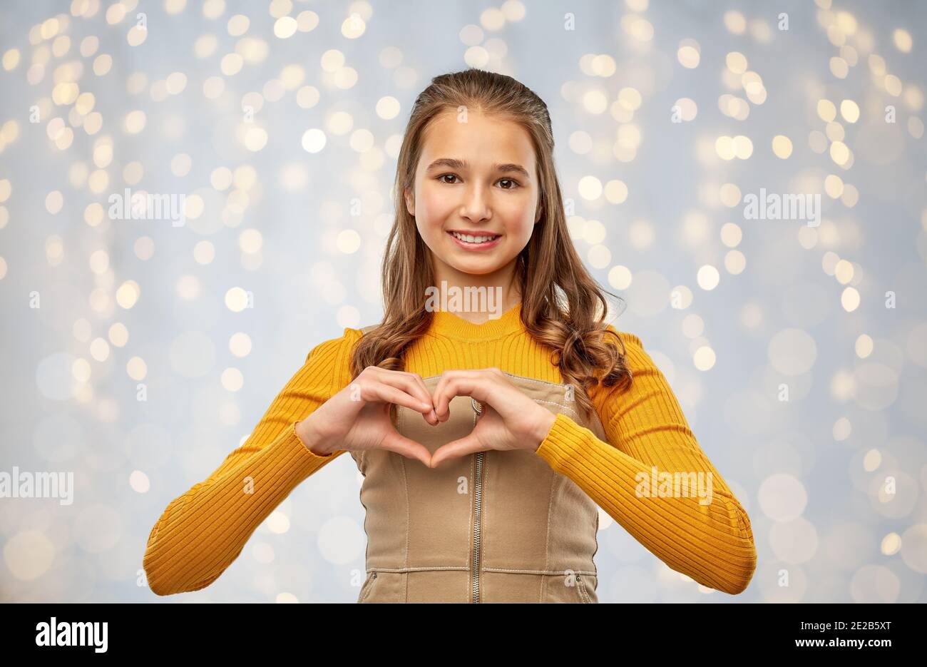 Happy girl making hand gesture hi-res stock photography and images - Alamy