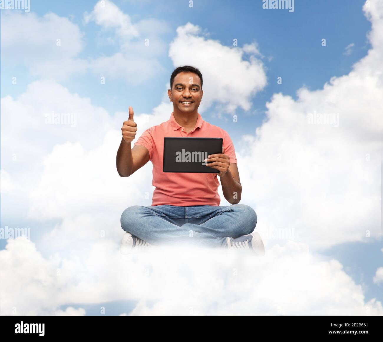 happy indian man with tablet pc showing thumbs up Stock Photo - Alamy