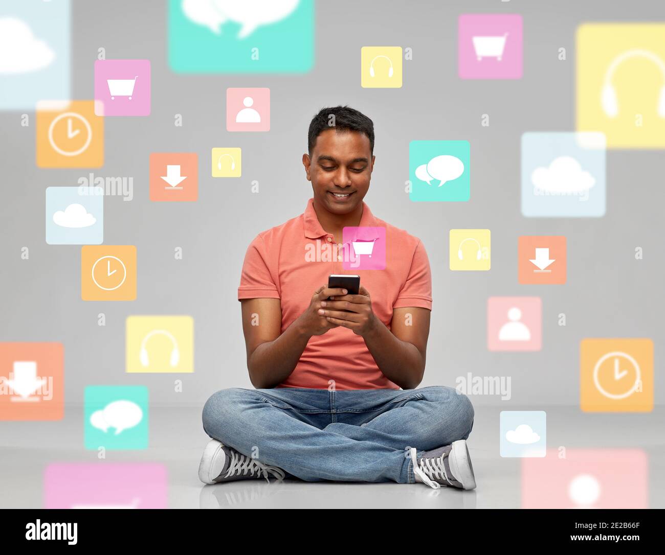 happy indian man using smartphone over app icons Stock Photo - Alamy
