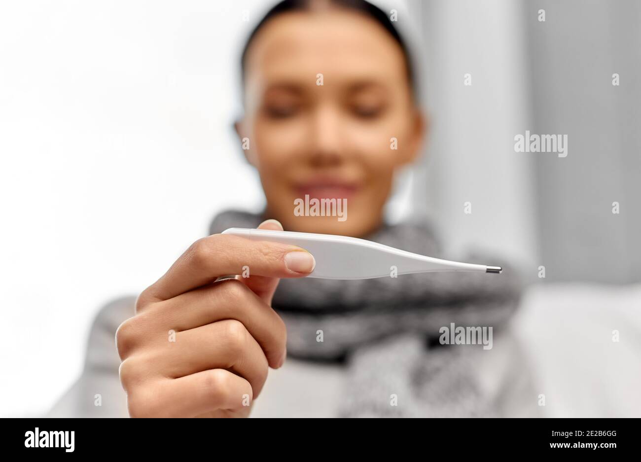 Young woman measuring temperature hi-res stock photography and images ...