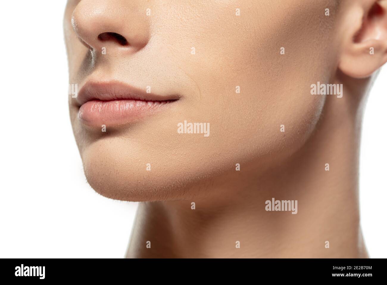 Lips. Close up face of young man isolated on white studio background ...