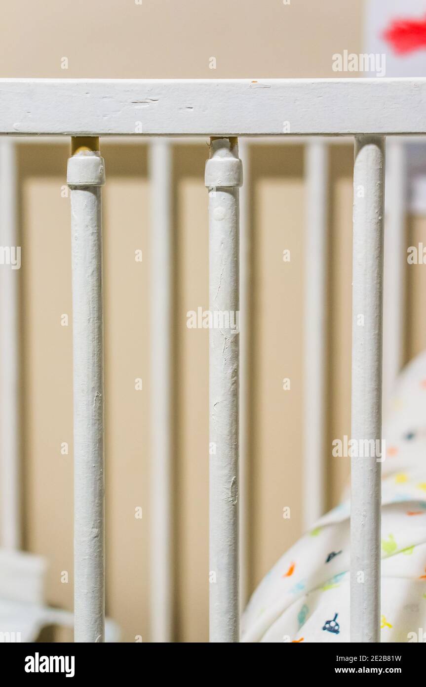 Vertical closeup of a baby cradle metallic handrail Stock Photo - Alamy