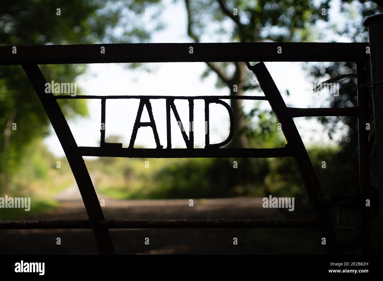 Gate with the word Land Stock Photo - Alamy