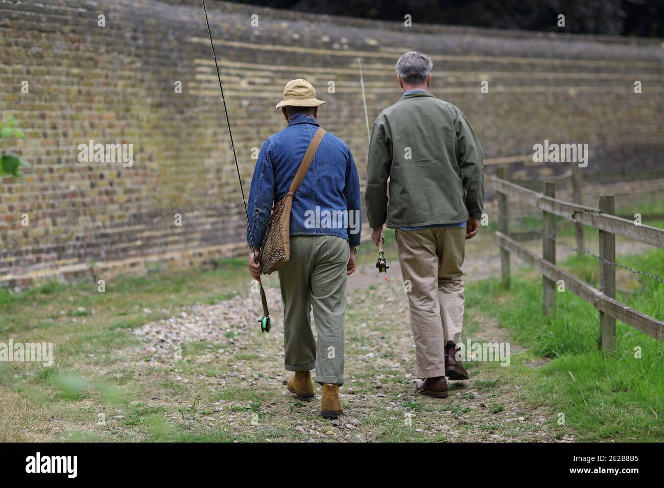 Two male friends going fishing together Stock Photo - Alamy