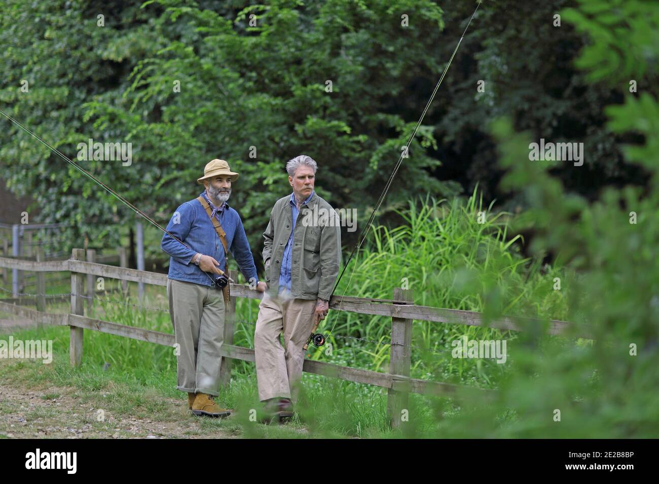 Two male friends going fishing together Stock Photo - Alamy