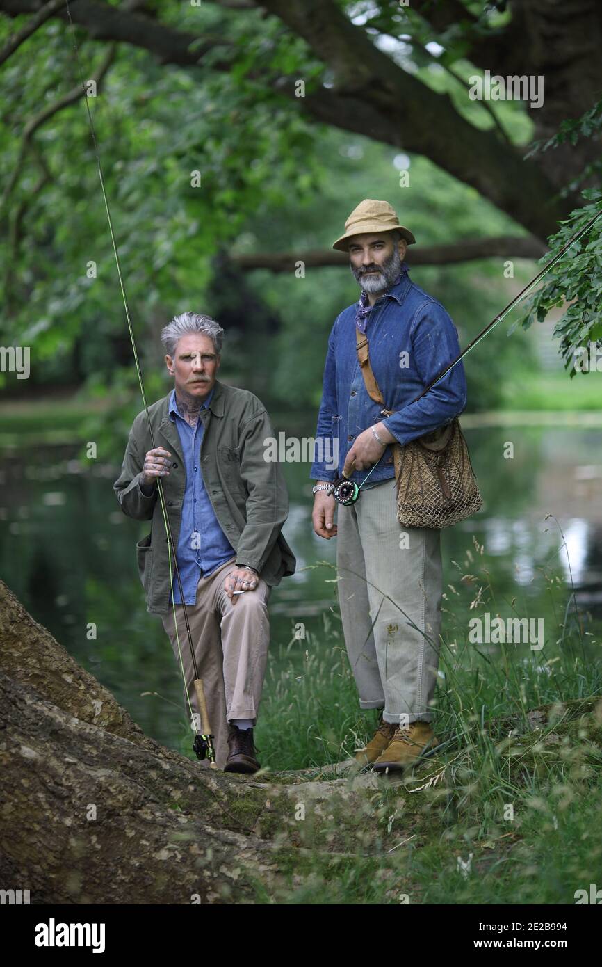 Two male friends fishing together Stock Photo - Alamy