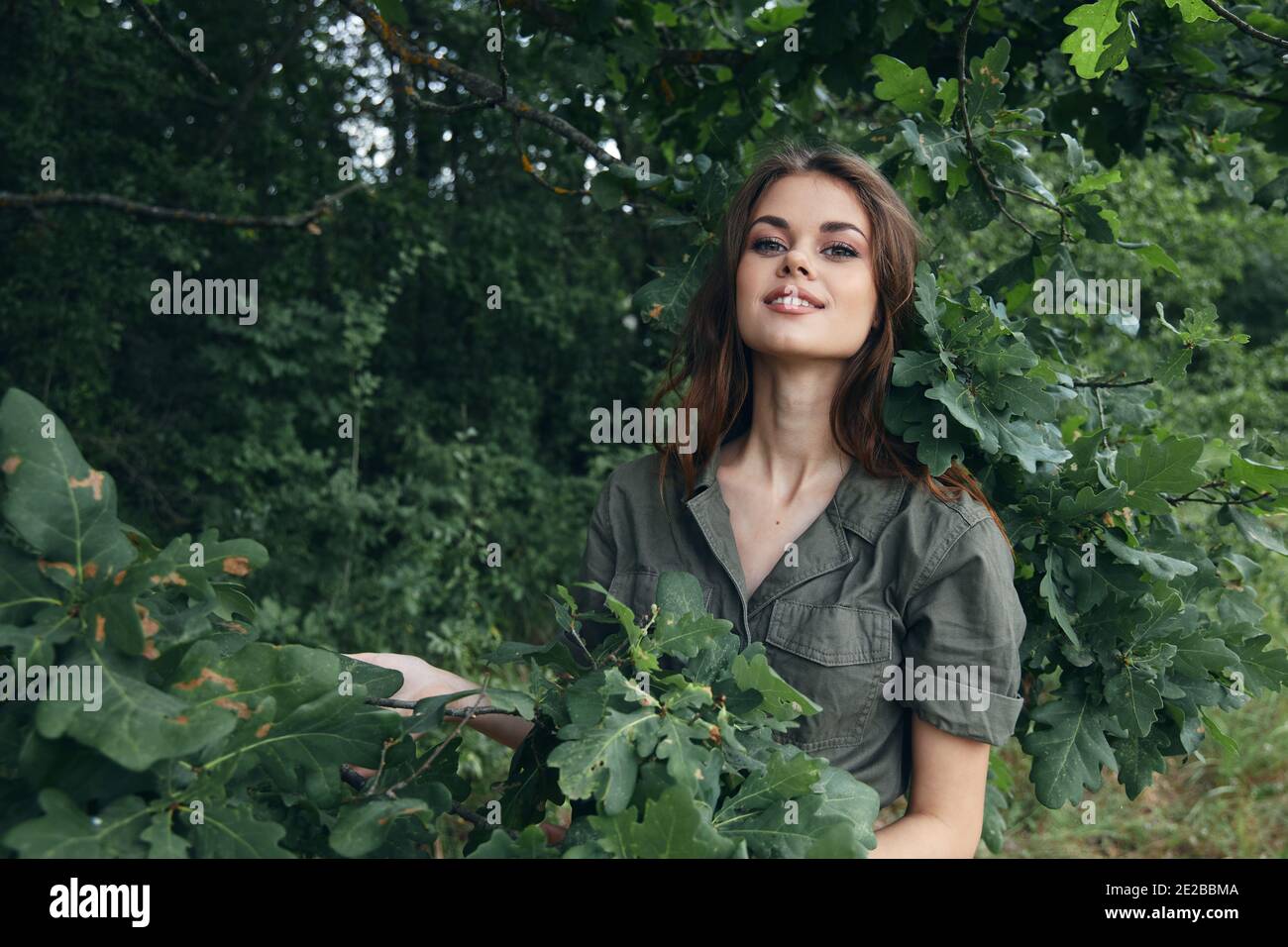 Woman in the forest Smile green leaves nature background fresh air ...