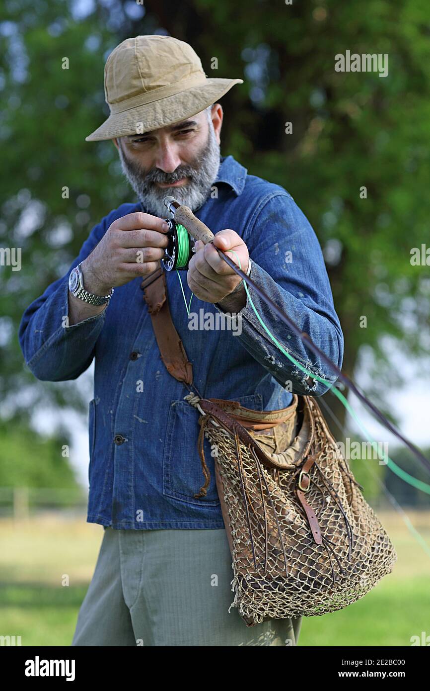 A man fly fishing ,setting up the fly rod Stock Photo - Alamy