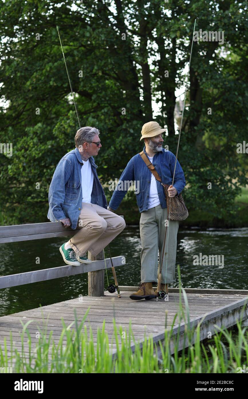 Two Man going fly fishing at lake Stock Photo - Alamy