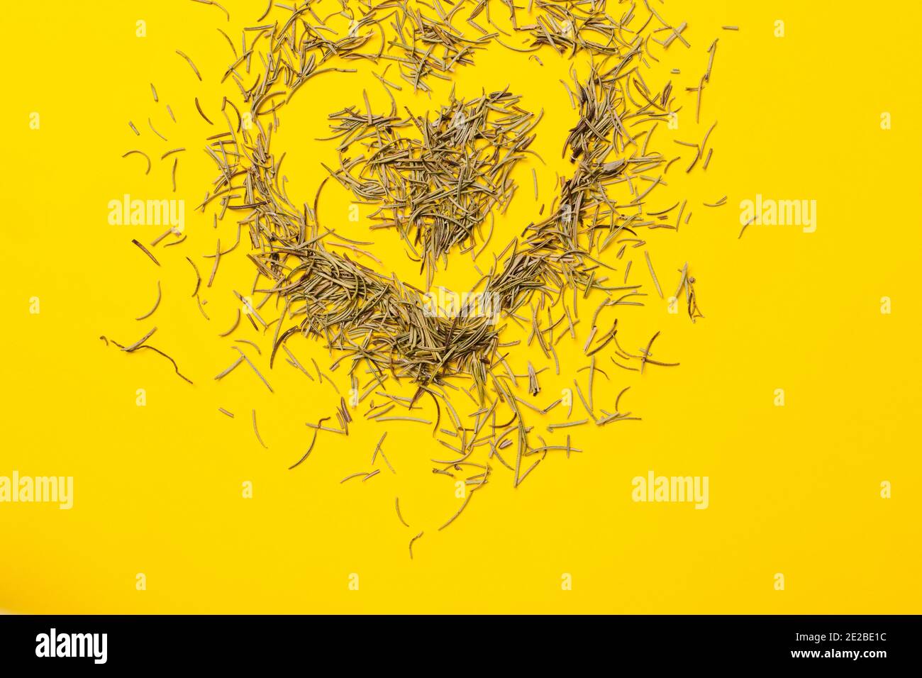 Heart shaped fragrant rosemary, illuminating background with bottom ...