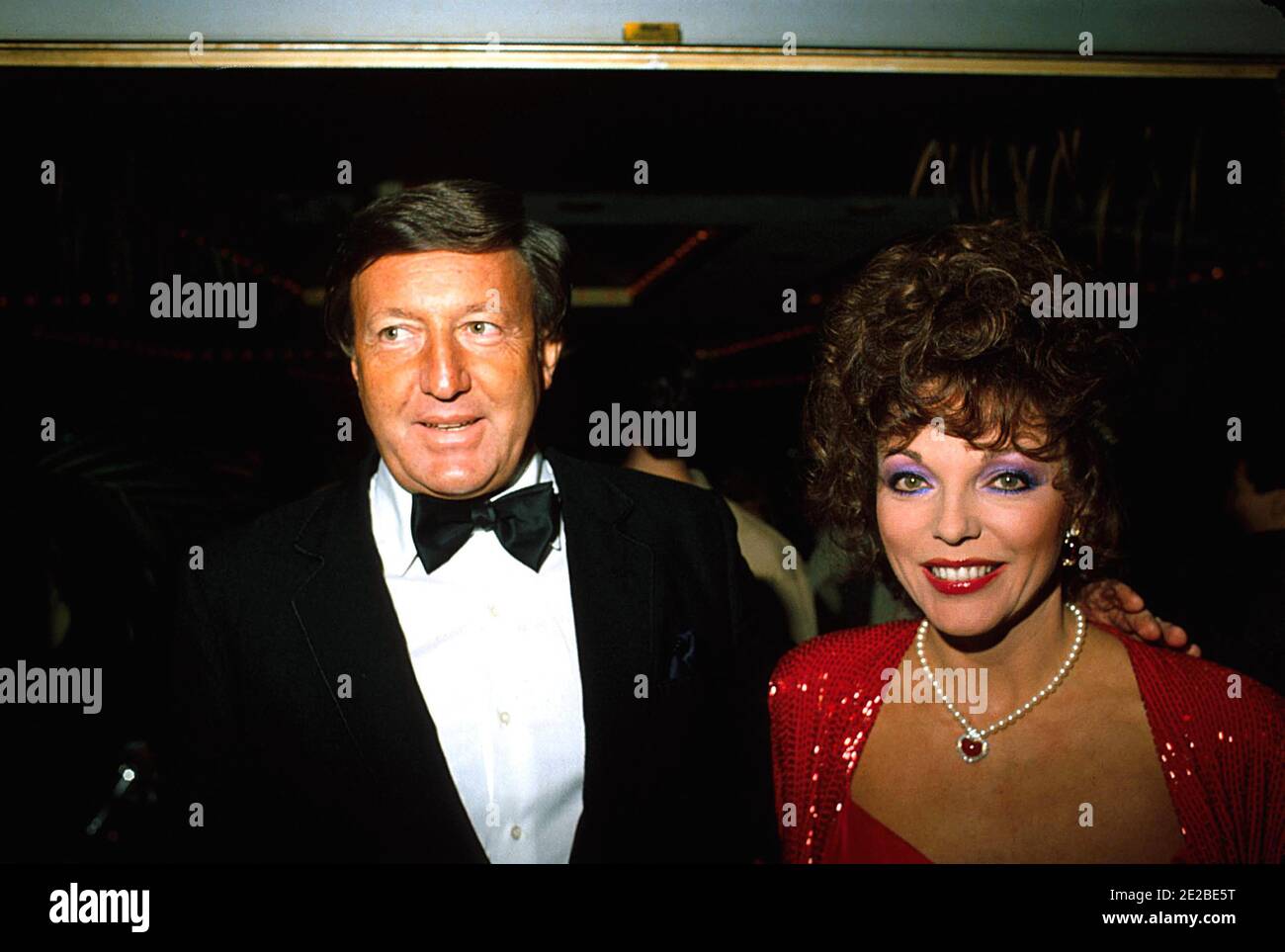 JOAN COLLINS WITH RON KASS Credit: Ralph Dominguez/MediaPunch Stock ...