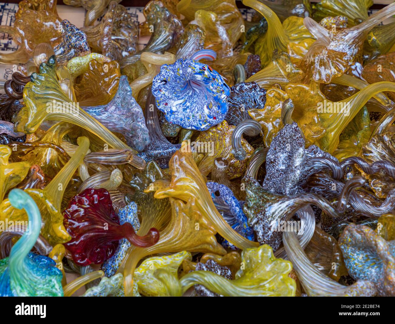 Texture, background. Many small various blown glass objects with ...
