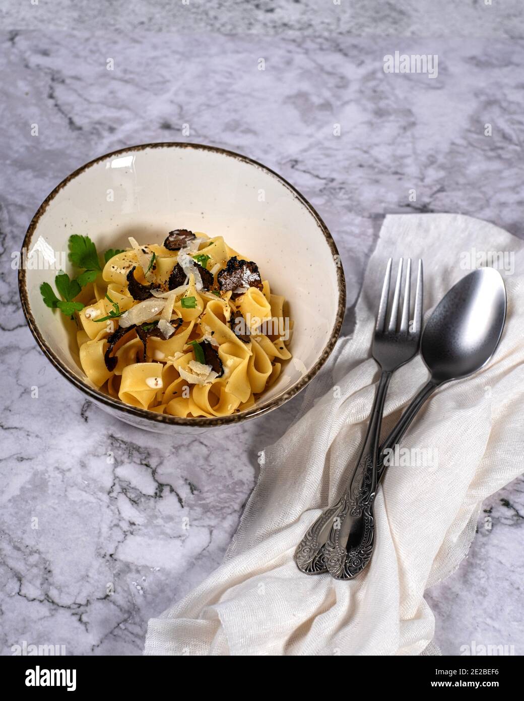 Ribbon noodles with white truffle sauce and shaved parmesan cheese ...