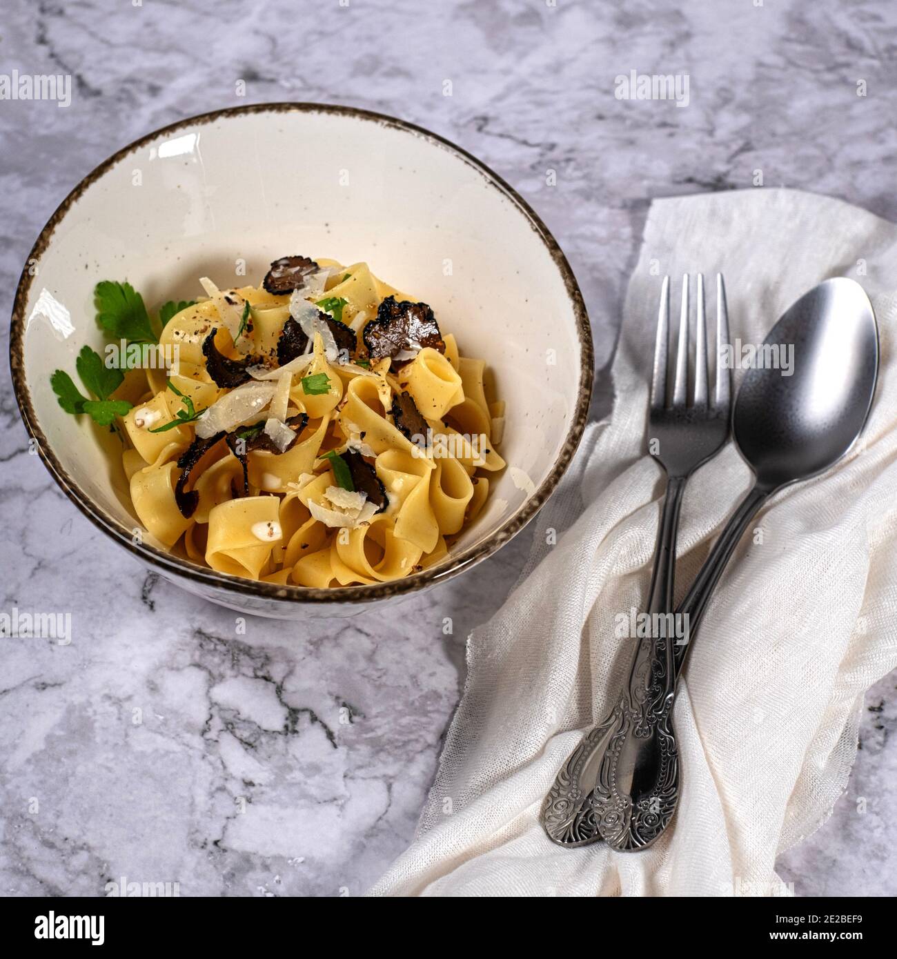 Ribbon noodles with white truffle sauce and shaved parmesan cheese ...