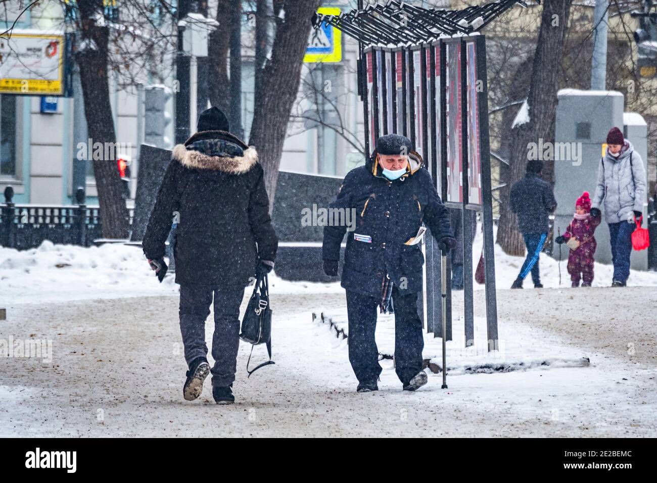 January 12, 2021. Snowfall in Moscow, Russia. People walk in a street ...