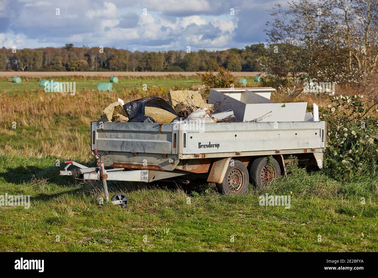 Utility trailer containing various waste Stock Photo - Alamy