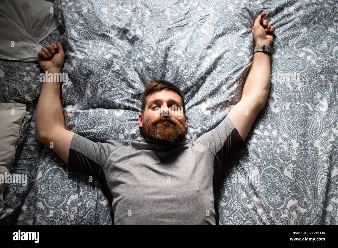 Man relaxing in bed hi-res stock photography and images - Alamy