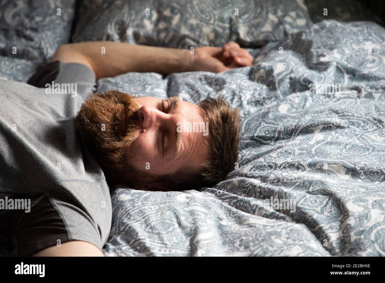 Man relaxing in bed hi-res stock photography and images - Alamy