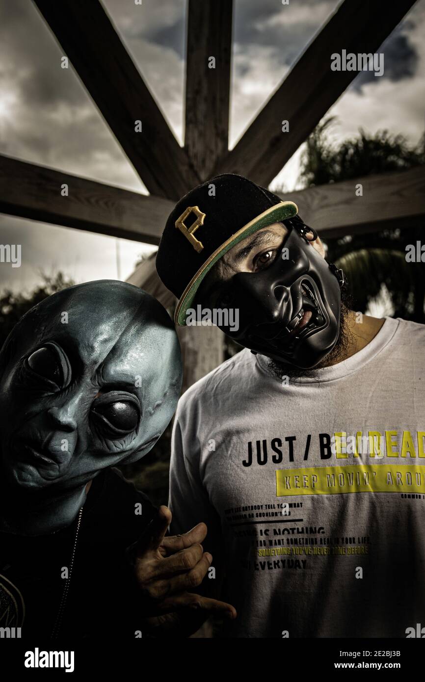 Men wearing scary masks on Halloween Stock Photo - Alamy