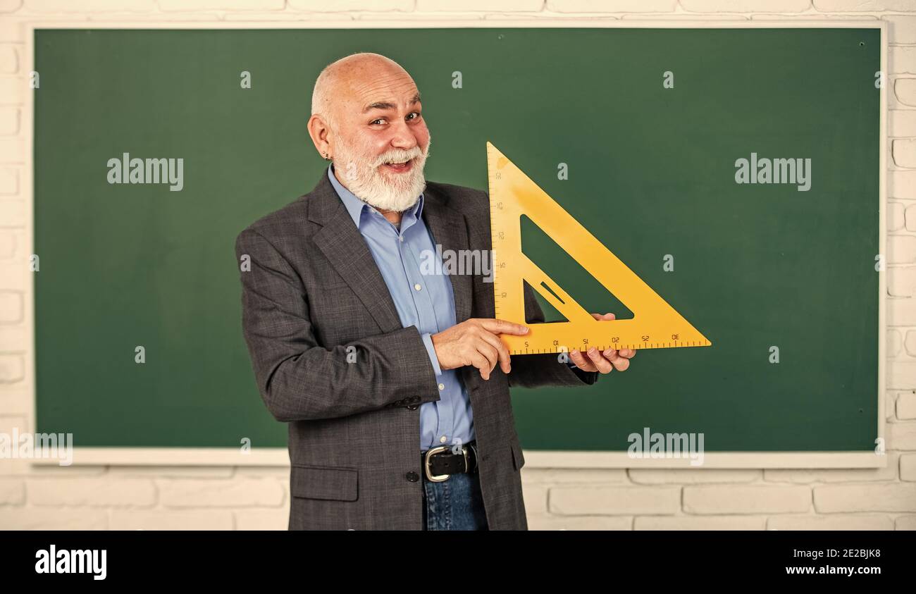 Understanding. bearded tutor man at blackboard. back to school. Math ...