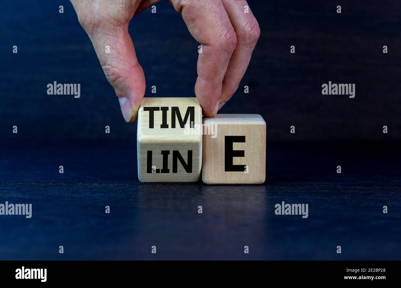 Timeline symbol. Businessman hand turns cubes with the word 'timeline ...