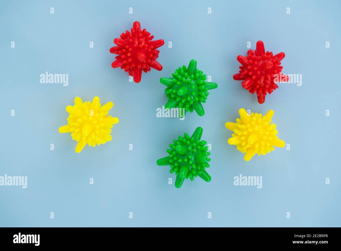 multicolored balloons coronavirus symbol on blue background with copy ...