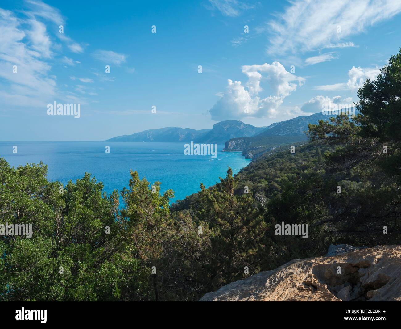 View over Gulf of Orosei with limestone cliffs, green bushes, white ...