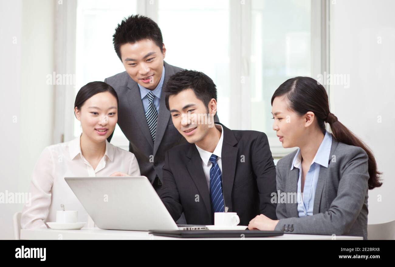 Group of businesspeople discussing working on computer high quality ...