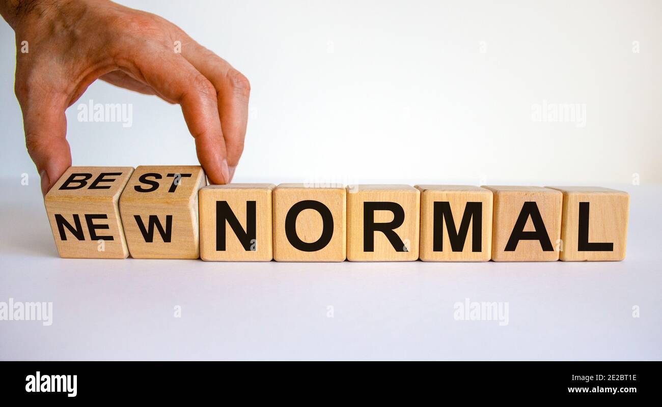 New best normal symbol. Hand turns cubes and changes words 'new normal ...