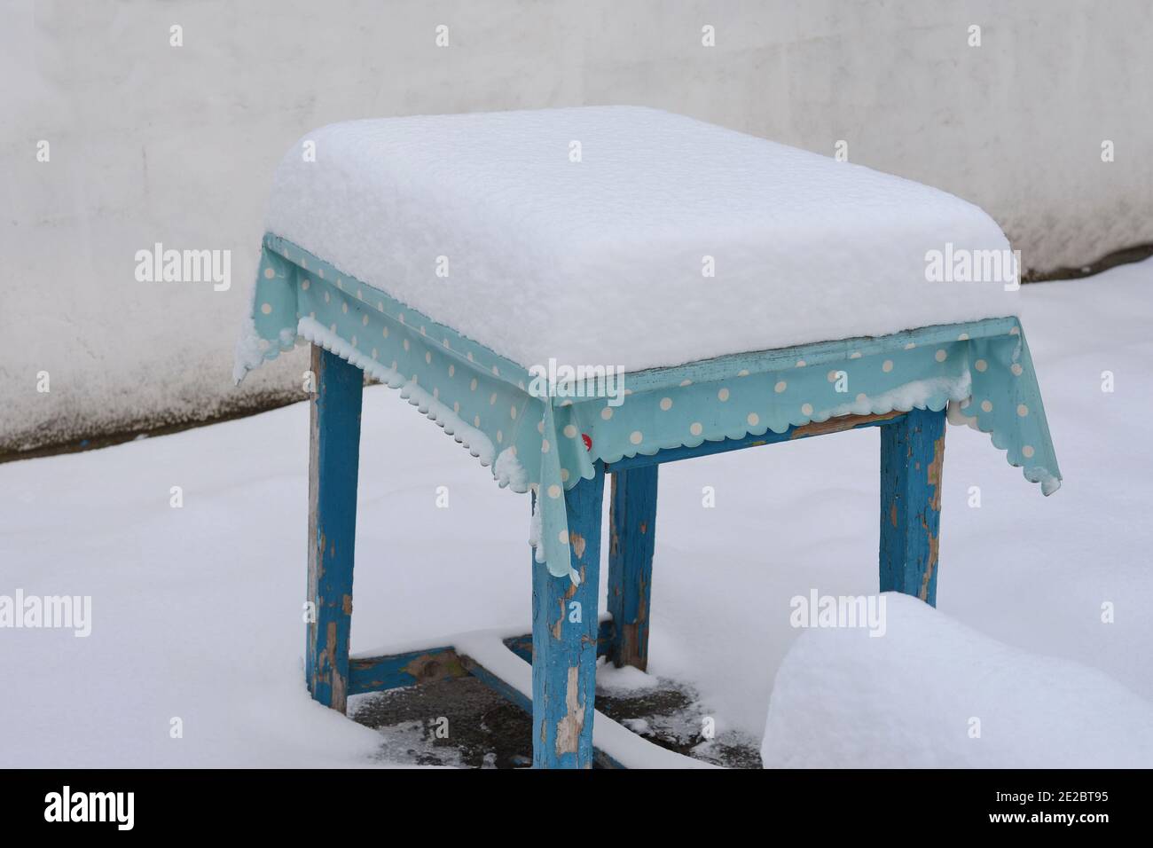 garden table covered in snow Stock Photo - Alamy