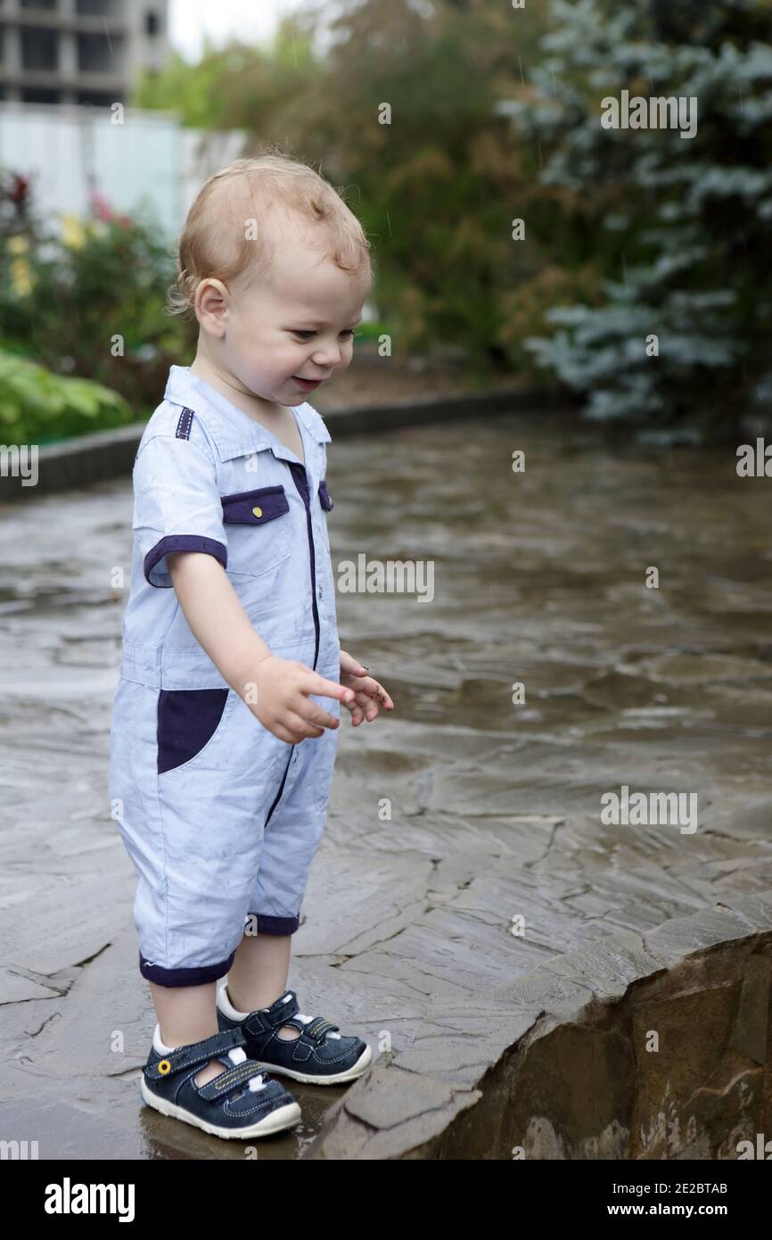 Portrait of child on edge of pit Stock Photo - Alamy
