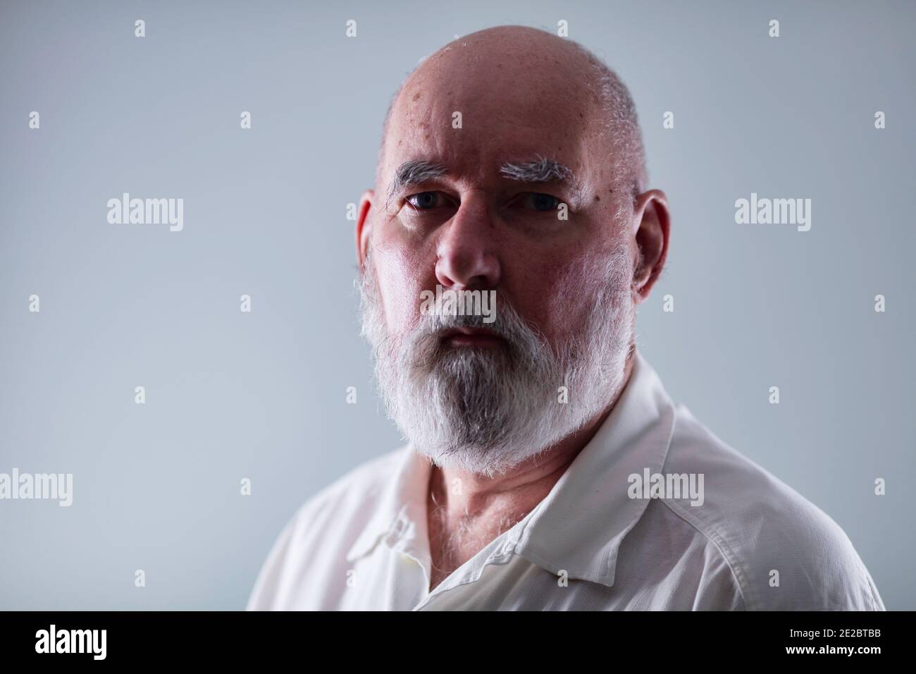 Portrait of a man in his 70s Stock Photo - Alamy