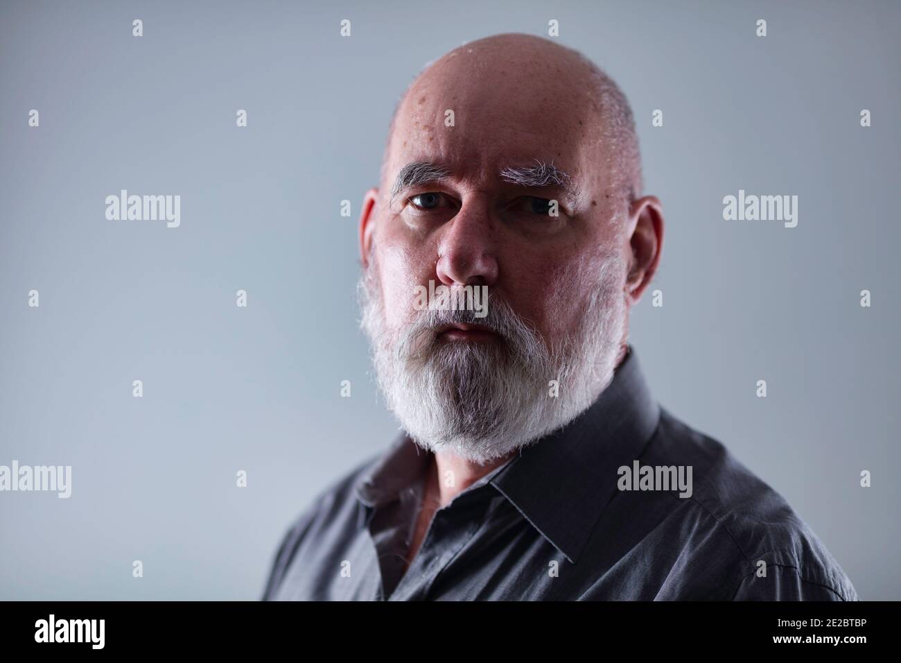 Portrait of a man in his 70s Stock Photo - Alamy