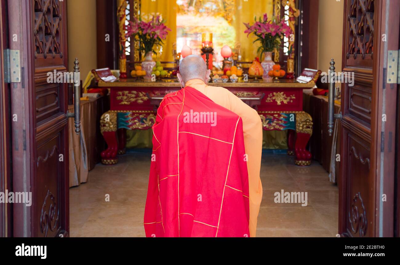 Praying monk from behind, on his knees. Po Lin Monastery (Lantau Island ...
