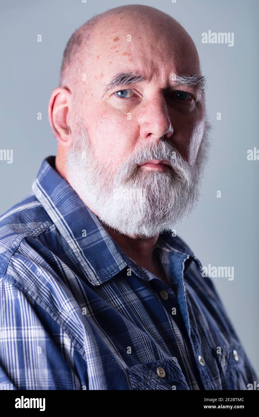 Portrait of a man in his 70s Stock Photo - Alamy