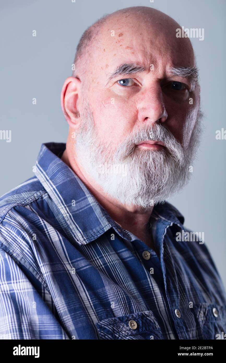 Portrait of a man in his 70s Stock Photo - Alamy