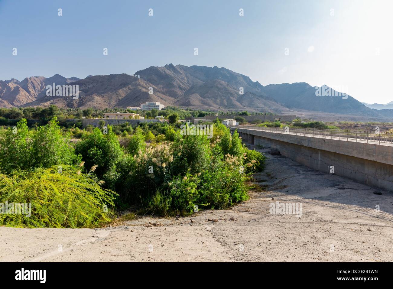 Sheikh Maktoum Bin Rashid Al Maktoum Dam riverbed in Hatta, with green ...