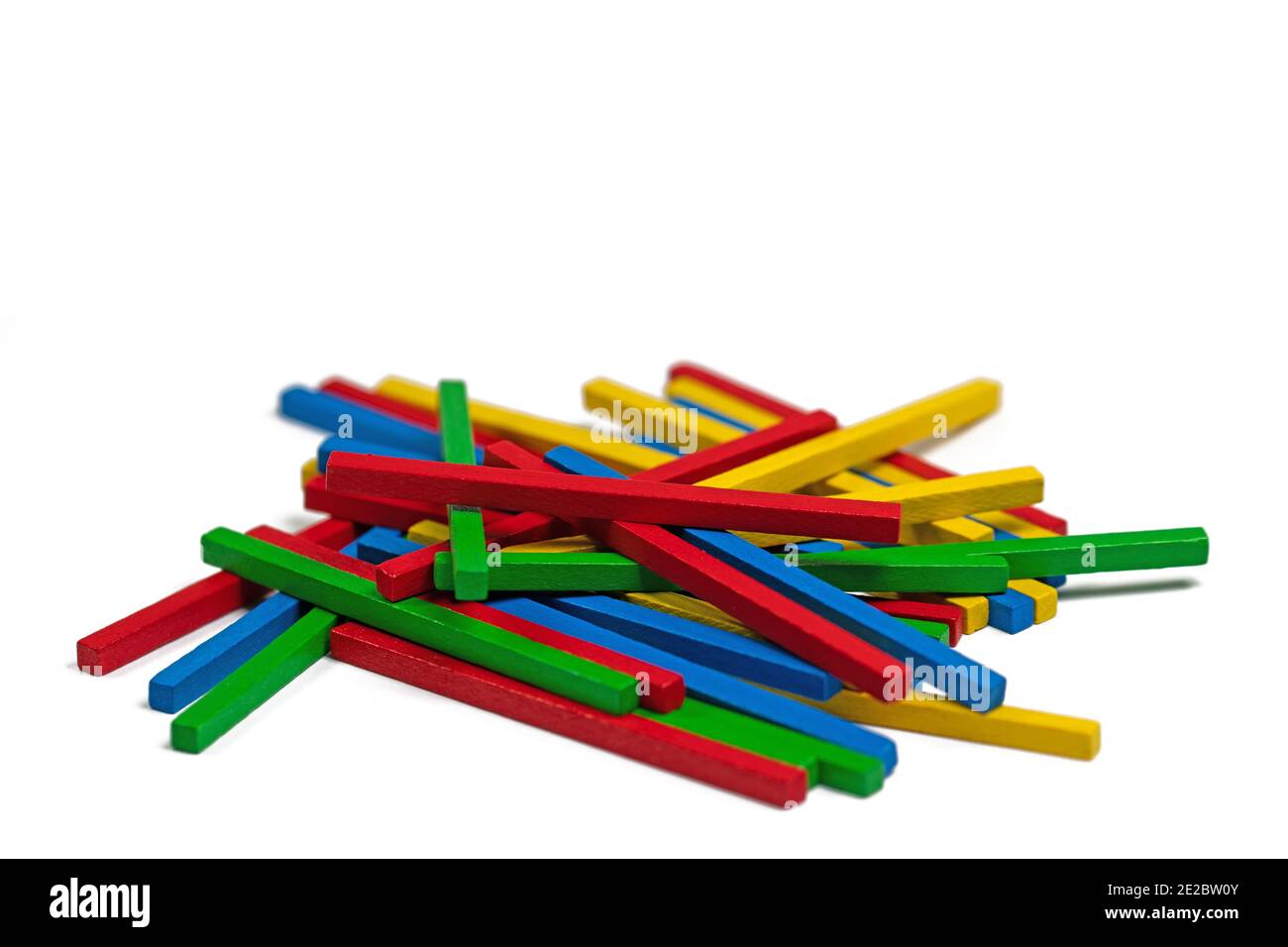 Lots of colorful wooden sticks against a white background Stock Photo ...