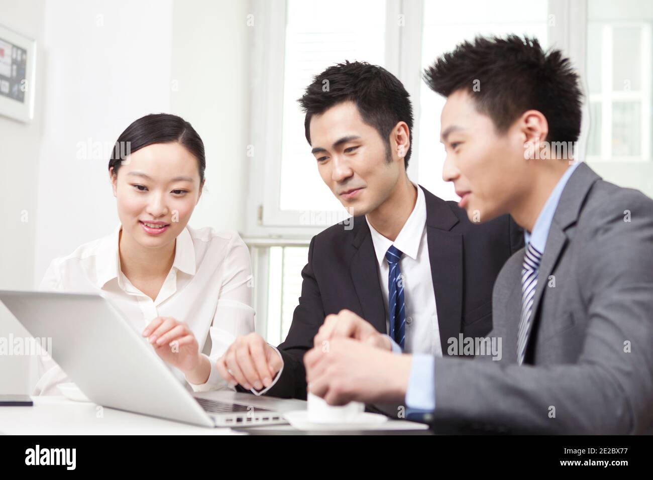 Group of businesspeople discussing working on computer high quality ...