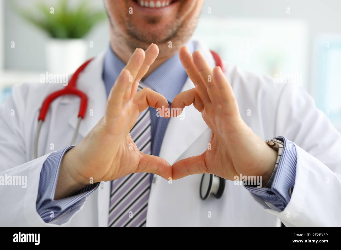 Male medicine doctor hands showing heart shape Stock Photo - Alamy