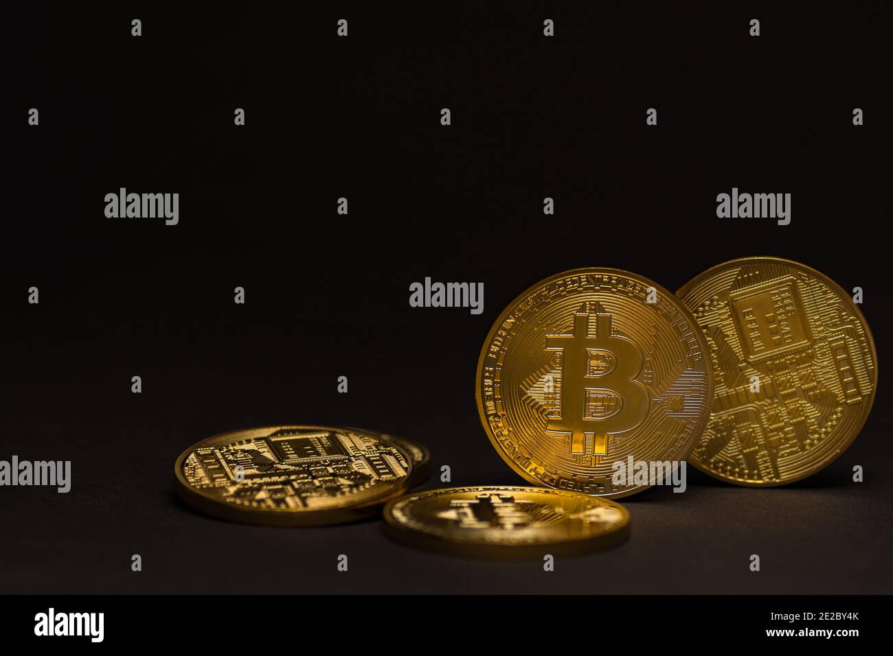 golden shiny valuable bitcoins front and back side with black ...